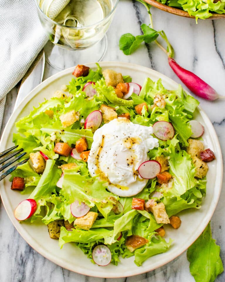 Frisée Salad with Lardons and Poached Eggs - Garlic & Zest